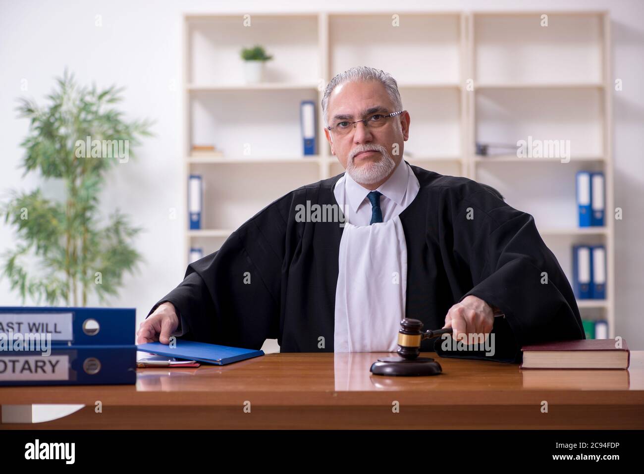 Old judge working in courthouse Stock Photo - Alamy