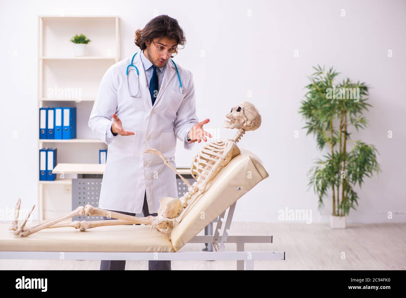 Crazy doctor examining the dead patient Stock Photo - Alamy