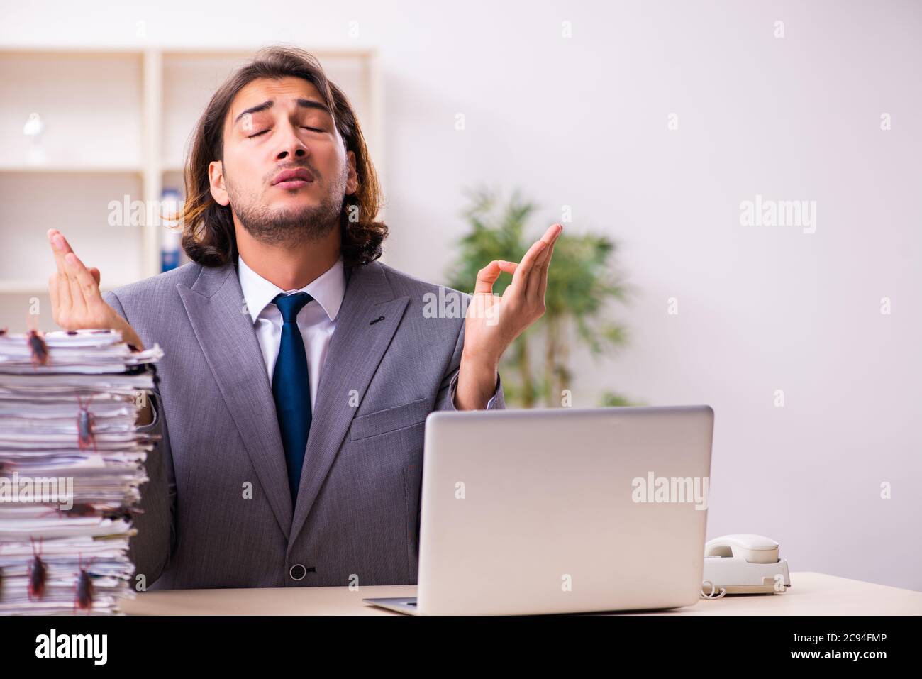 Young employee and too many cockroaches in the office Stock Photo - Alamy