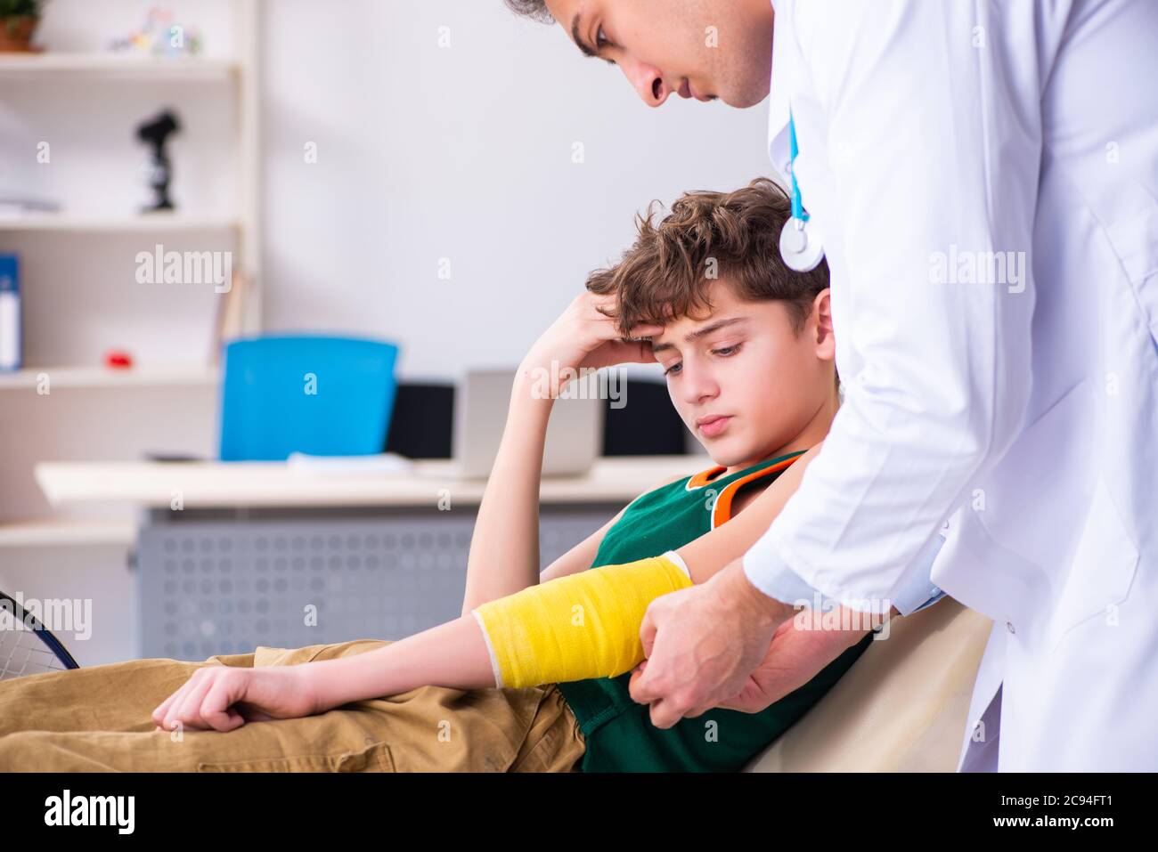 Sick boy visiting young doctor pediatrician Stock Photo - Alamy