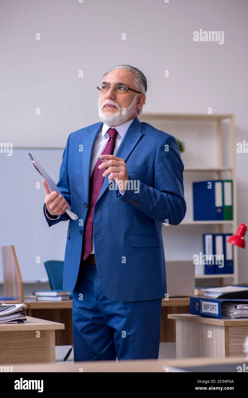 Male boss employee working in the office Stock Photo - Alamy