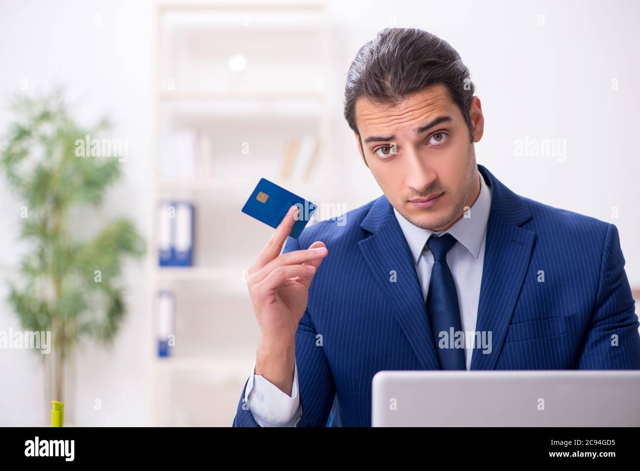 Young logistics specialist working in the office Stock Photo - Alamy