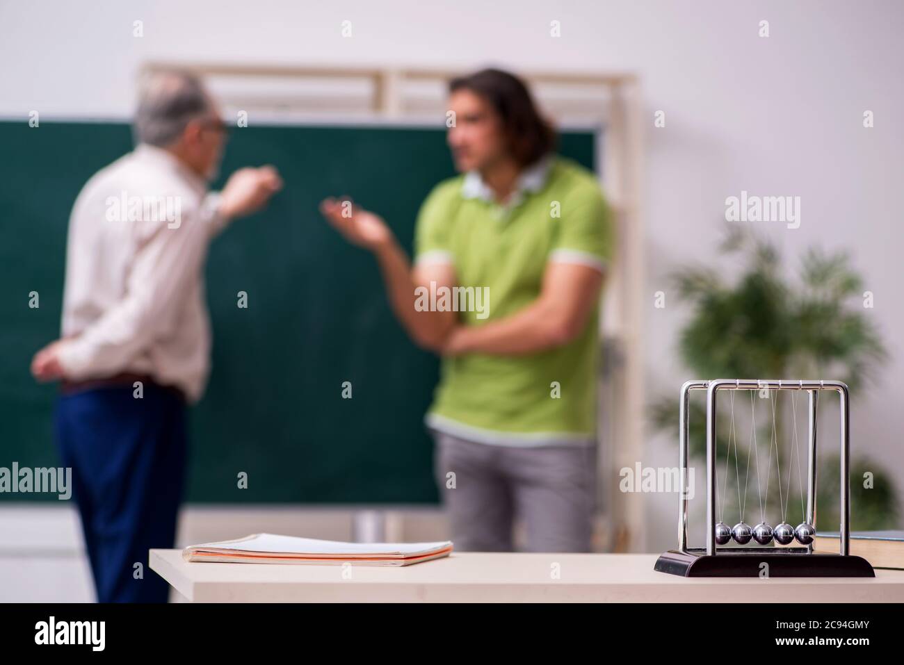 Old professor physicist and student in the classroom Stock Photo - Alamy