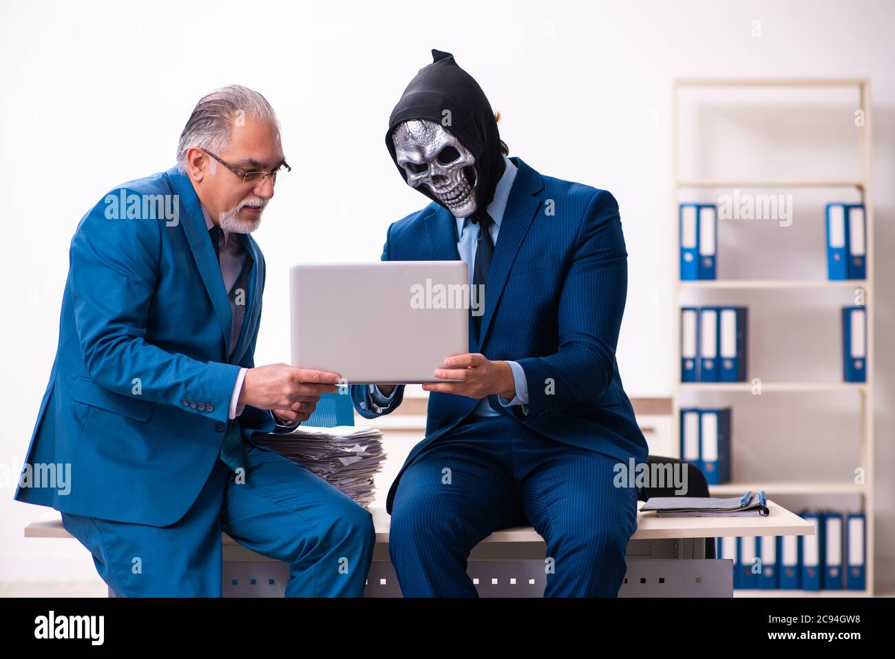 Old businessman employee making deal with the devil Stock Photo - Alamy