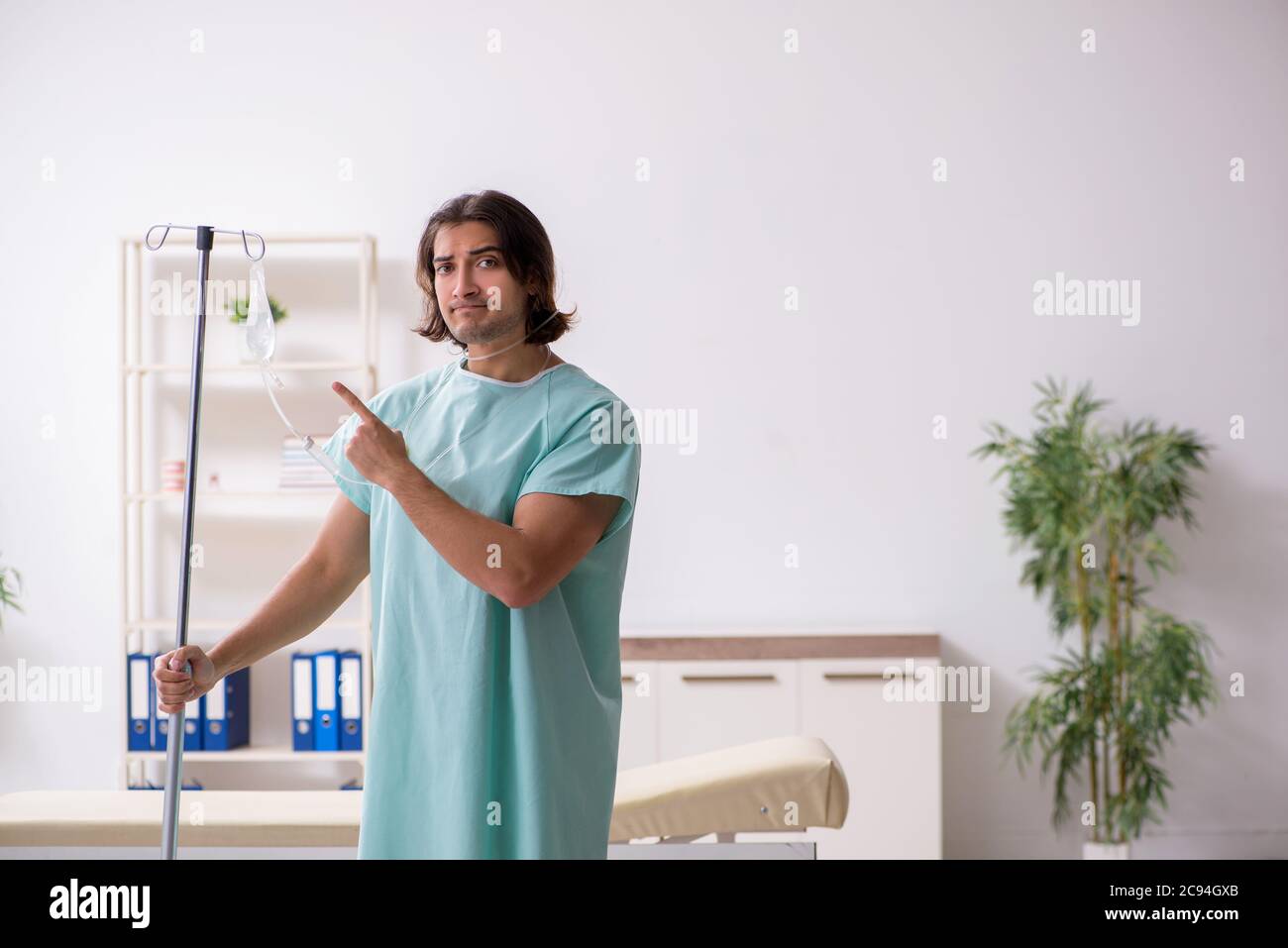 Young mad man in the hospital ward Stock Photo - Alamy