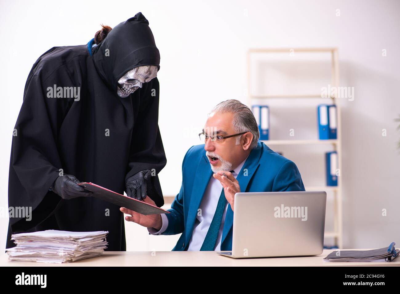 Old businessman employee making deal with the devil Stock Photo - Alamy