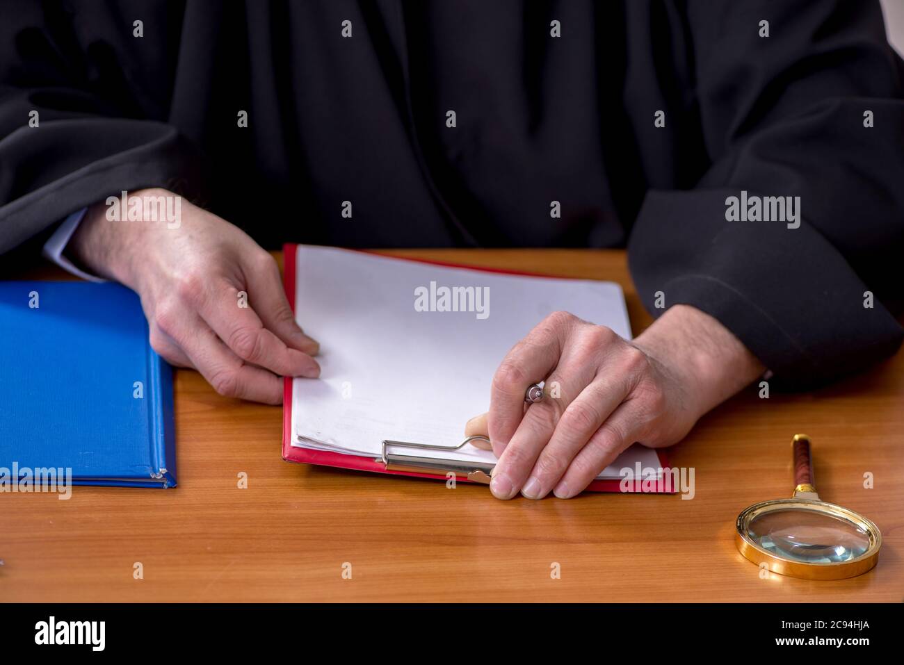 Old male judge working in the courthouse Stock Photo - Alamy