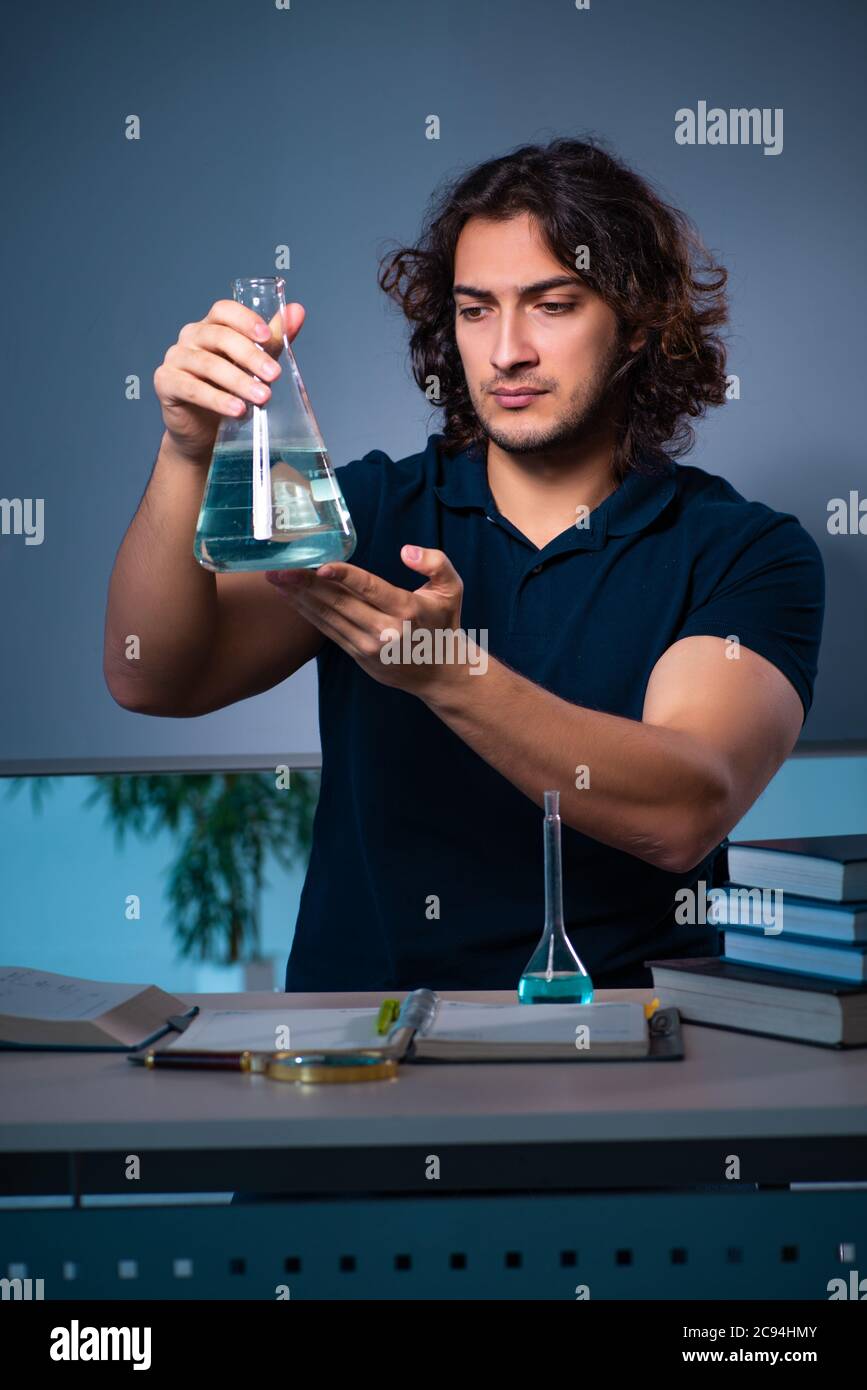 Young student in the classroom at night Stock Photo - Alamy