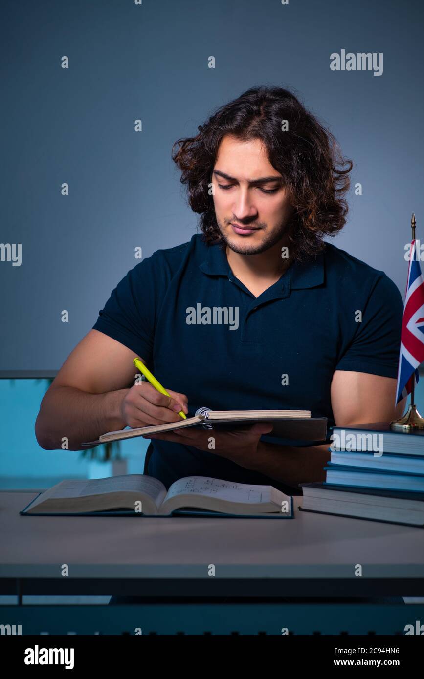 Young student in the classroom at night Stock Photo - Alamy
