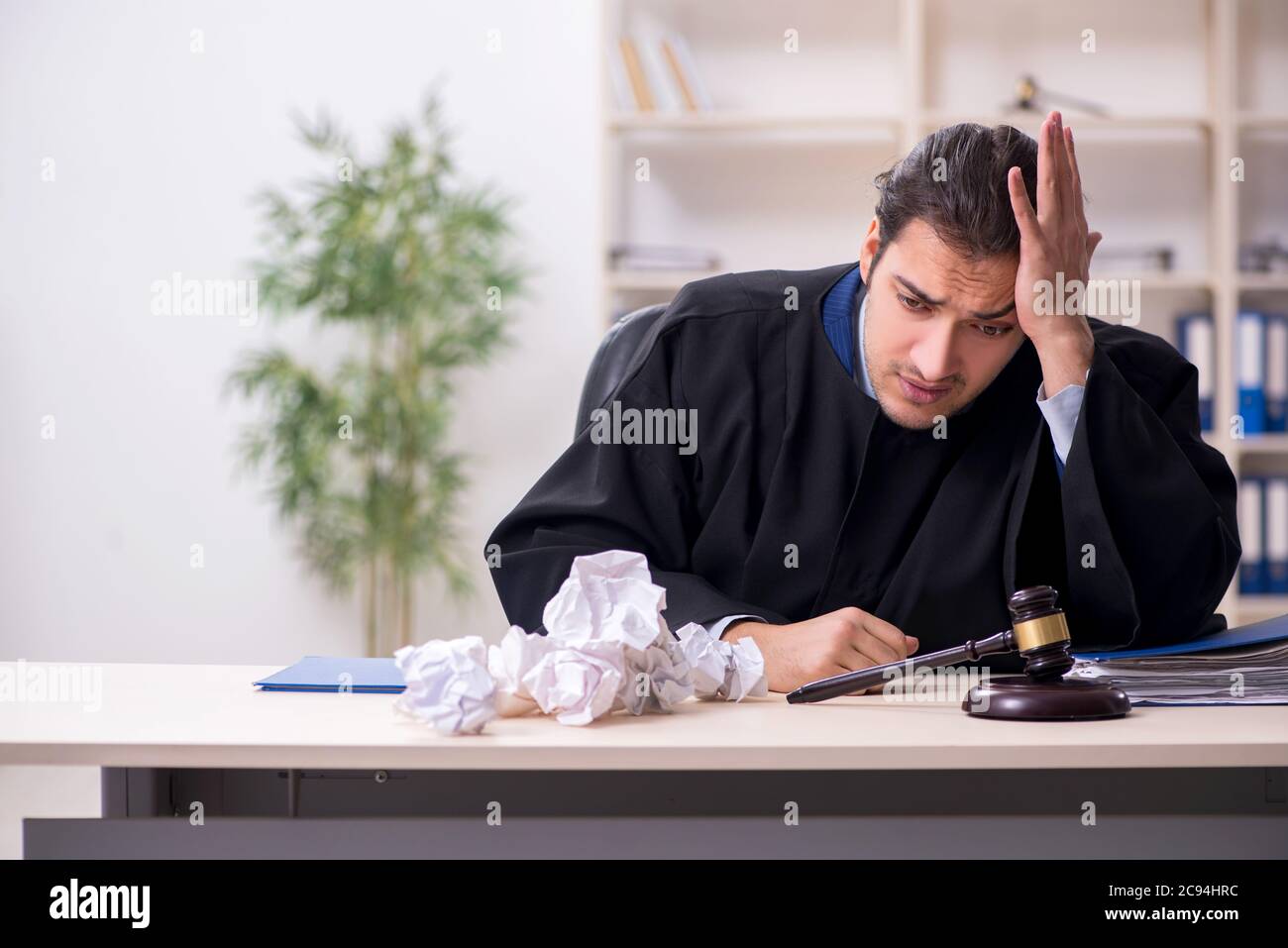Young judge working in courthouse Stock Photo - Alamy