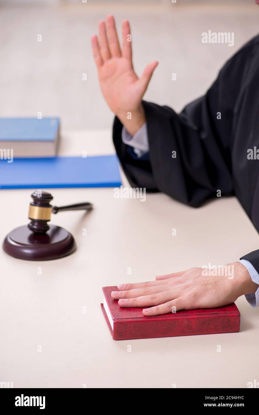 Young judge working in courthouse Stock Photo - Alamy