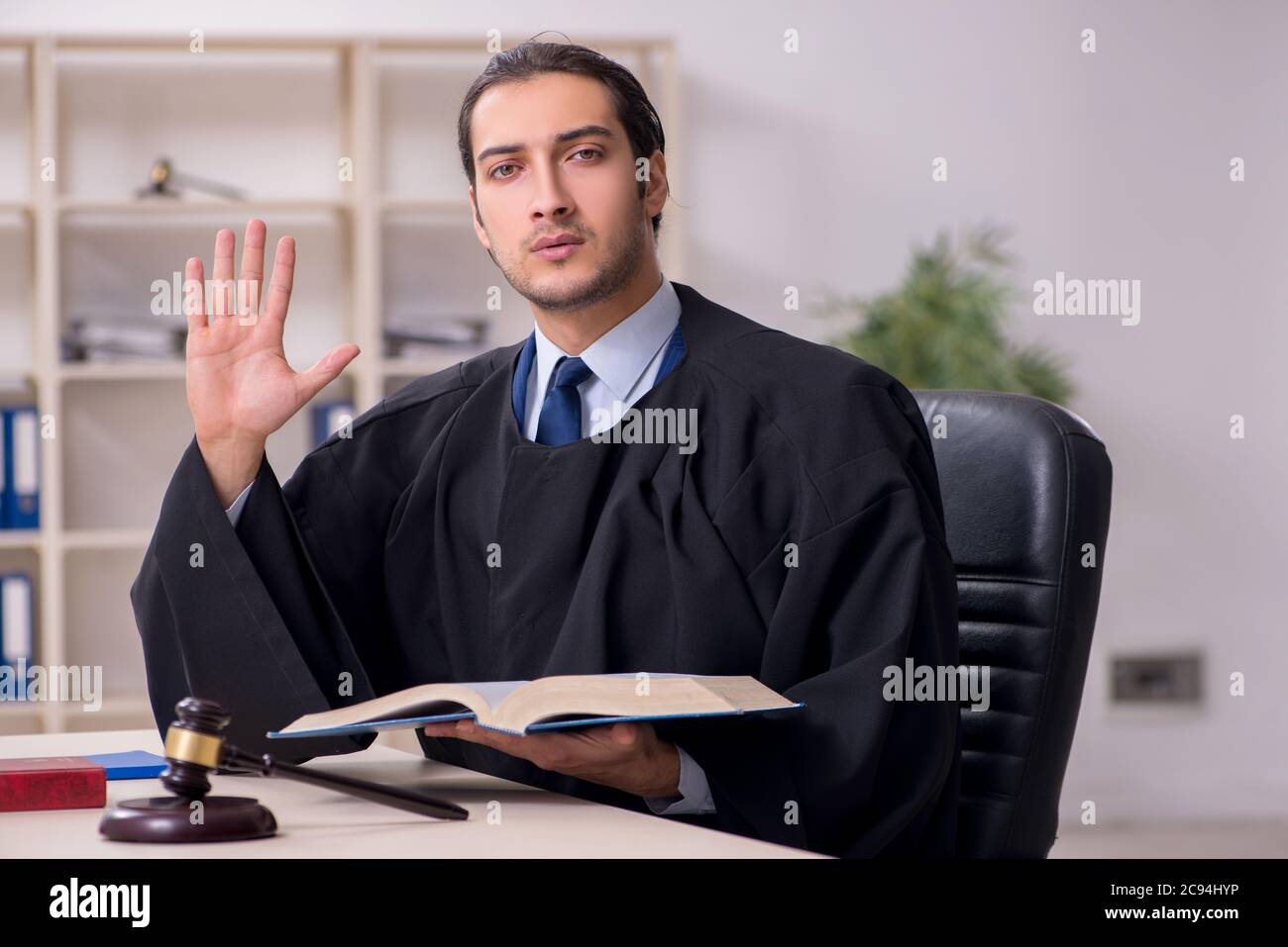 Young judge working in courthouse Stock Photo - Alamy