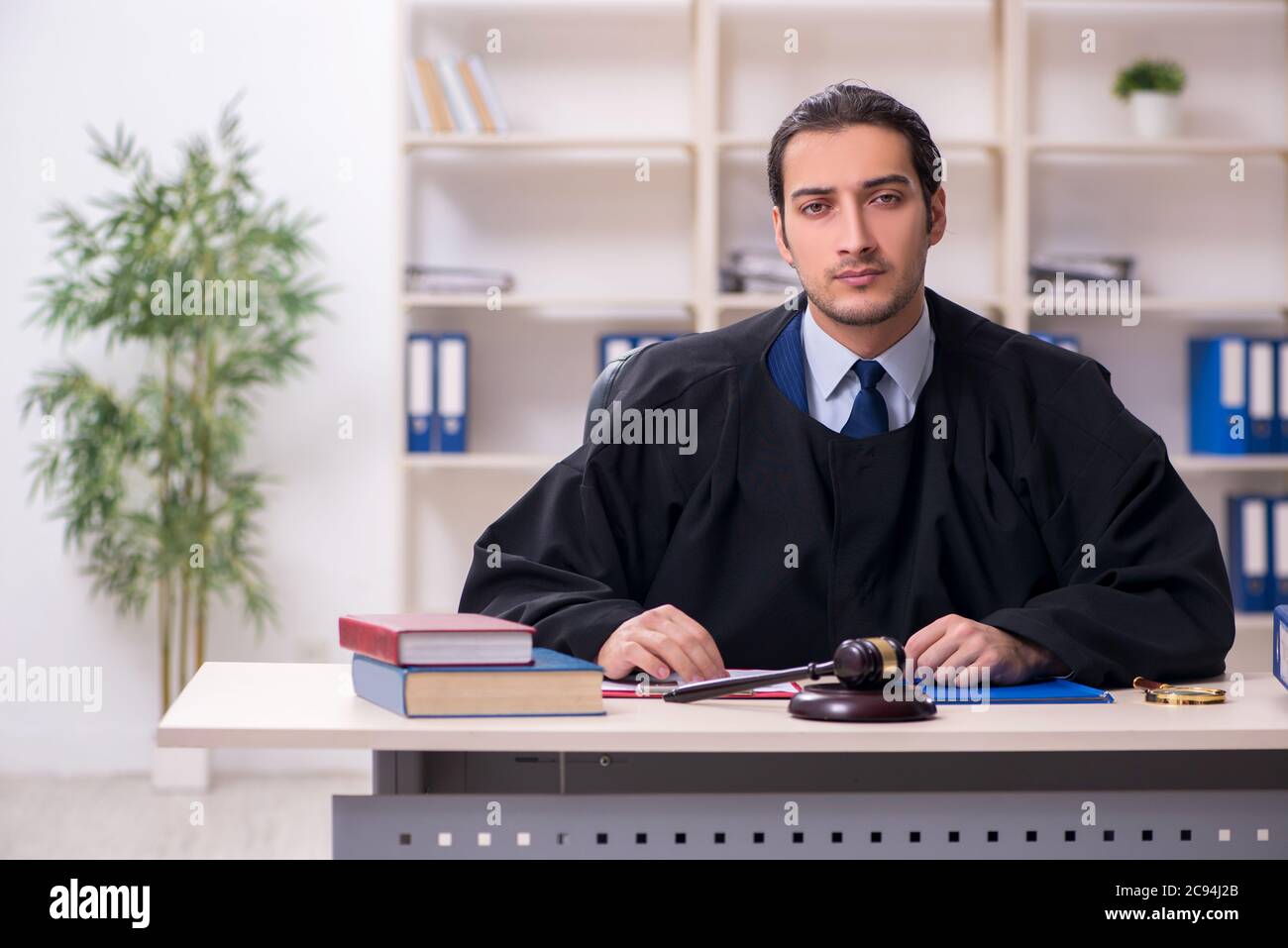 Young judge working in courthouse Stock Photo - Alamy