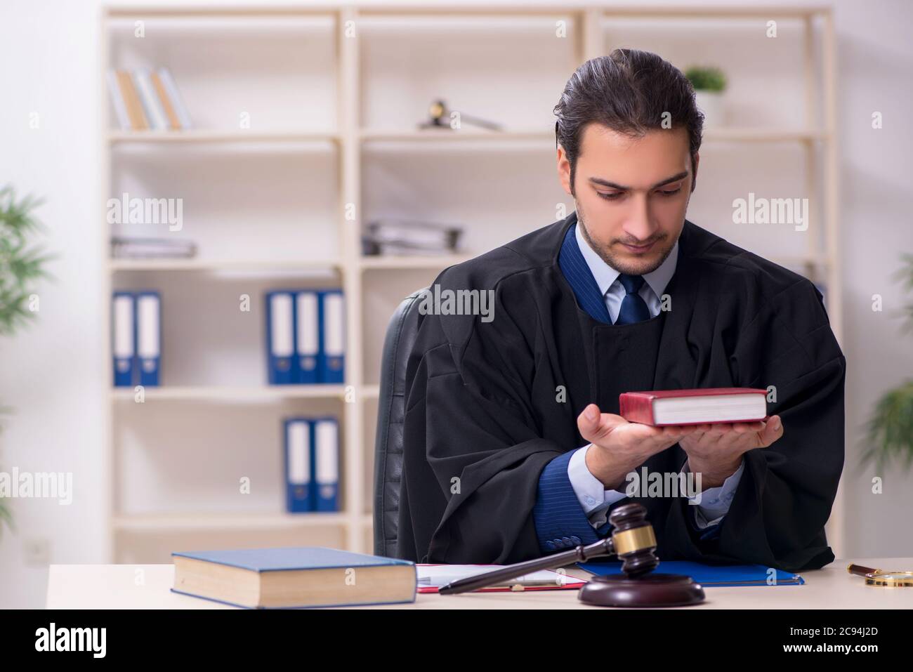 Young judge working in courthouse Stock Photo - Alamy