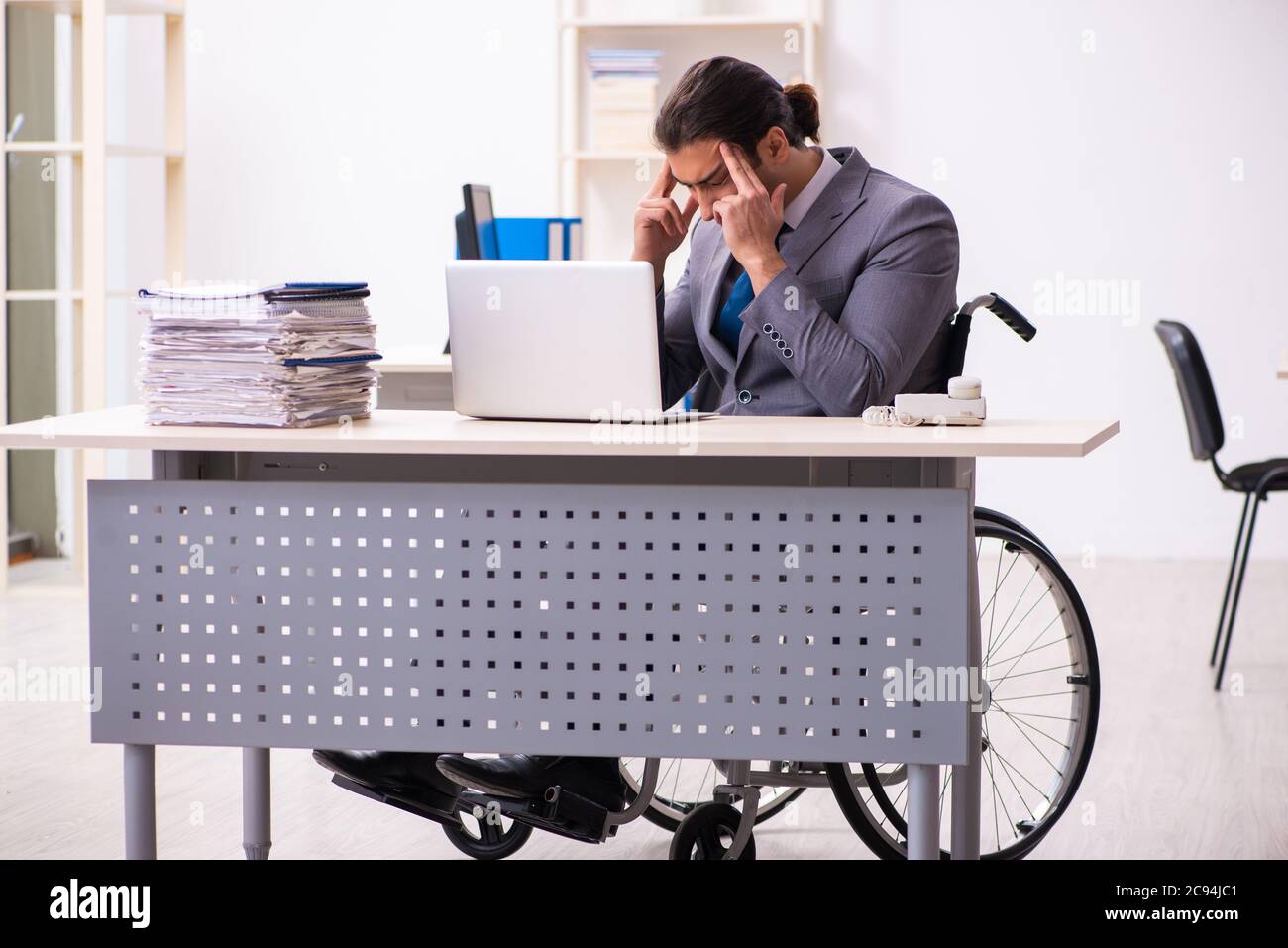 Disabled employee in the office environment Stock Photo - Alamy