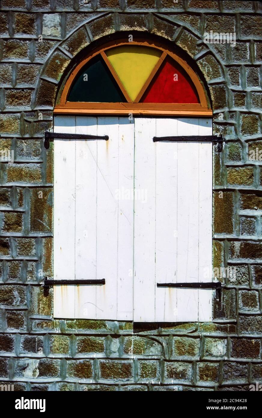 Window shuttered in the stone wall of a church Stock Photo - Alamy