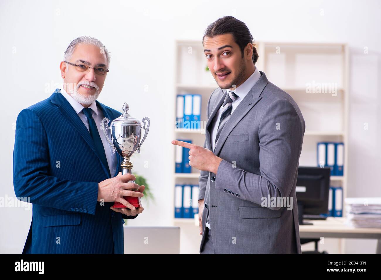 Two employees working in the office Stock Photo - Alamy