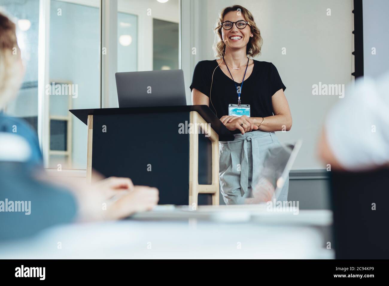 Female giving speech podium hi-res stock photography and images - Alamy