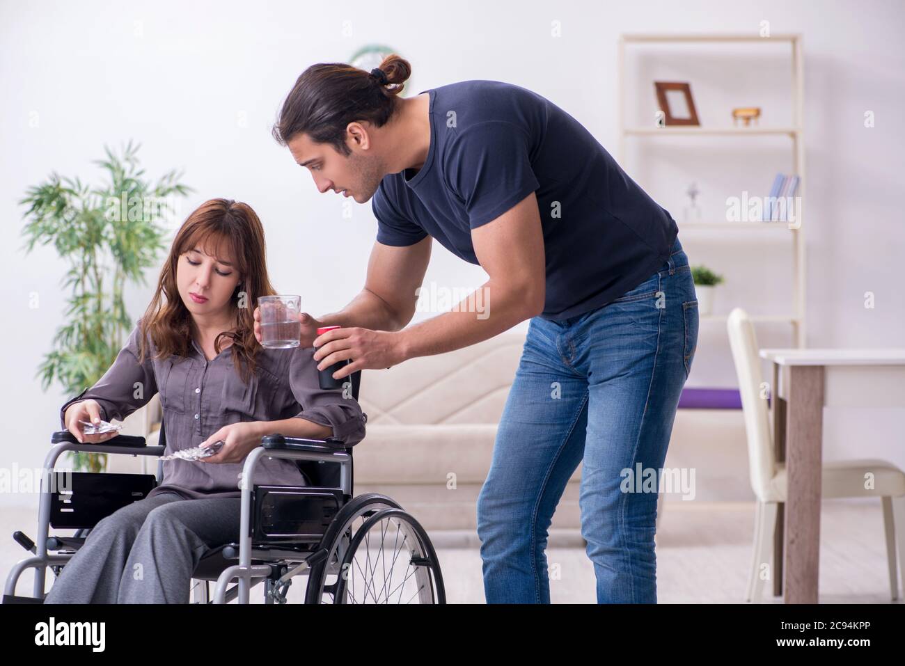 Disabled wife and husband at home Stock Photo - Alamy