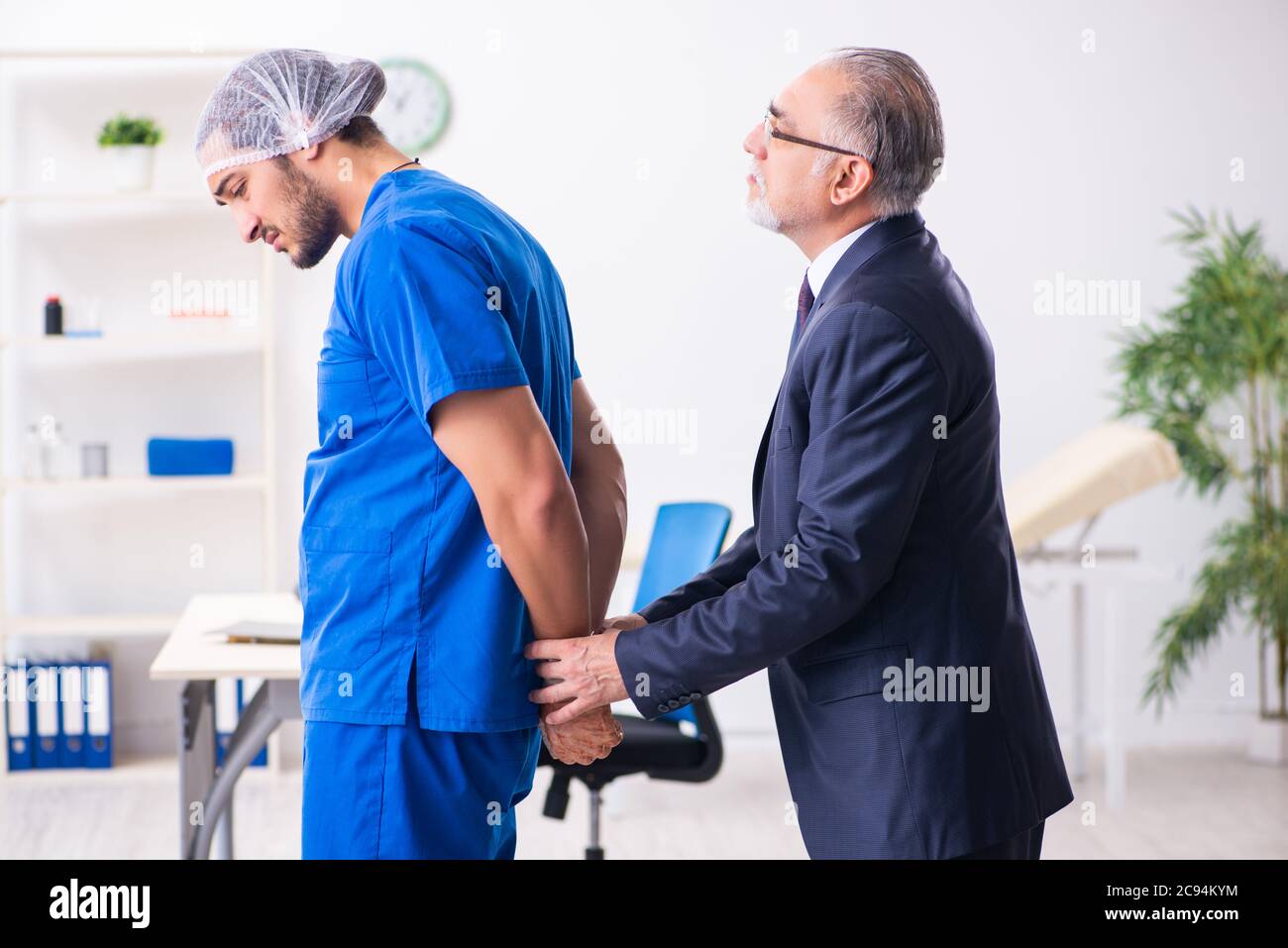 Doctor in courthouse meeting with advocate Stock Photo - Alamy