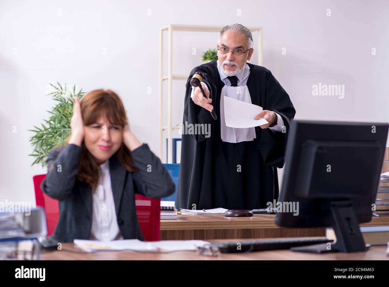 Old judge and his young secretary in the office Stock Photo - Alamy