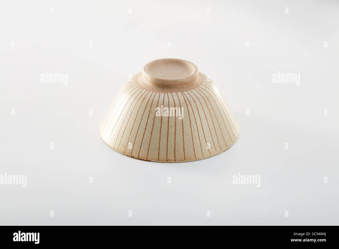 An upside-down off-white striped ceramic rice bowl Stock Photo - Alamy
