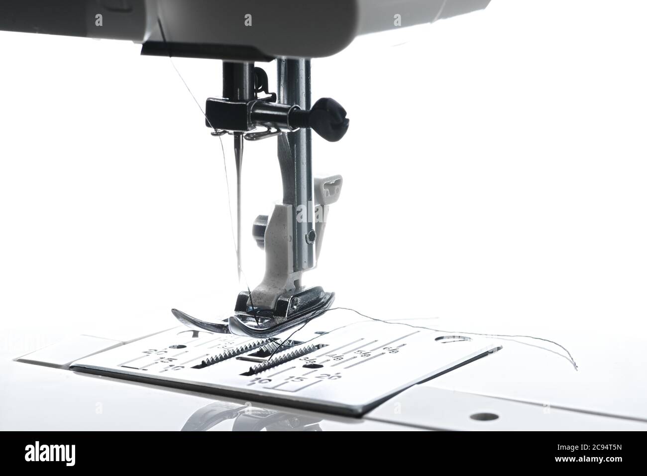 8 - Medium horizontal image of sewing machine working area. Plate foot ...