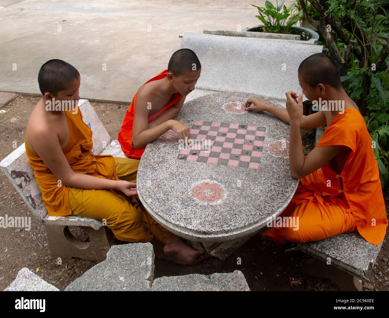 Young Buddhist monks playing board game in Thailand, Southeast Asia ...