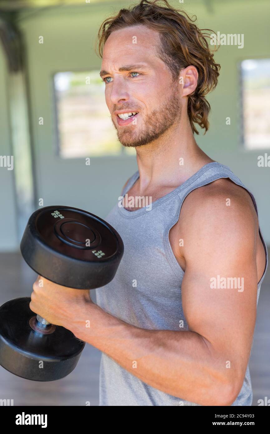 Man lifting dumbbell hi-res stock photography and images - Alamy