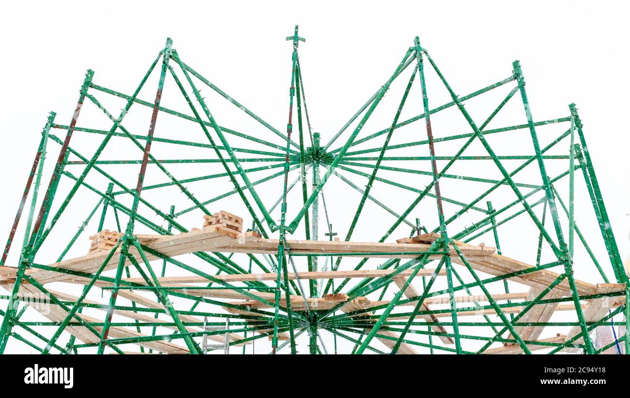 Scaffolding with a wooden deck in the form of a standing platform as a ...