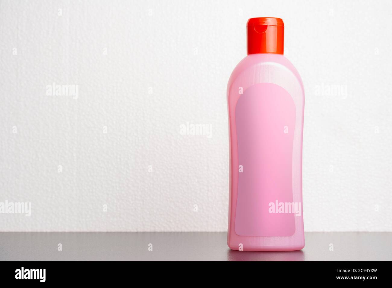 Hair shampoo bottle in front of light gray background, editable mock-up ...