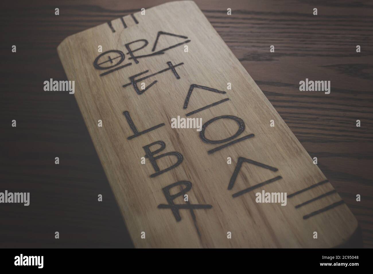 Photograph of a handcraft of aa latin phrase on wood, that means: Pray ...