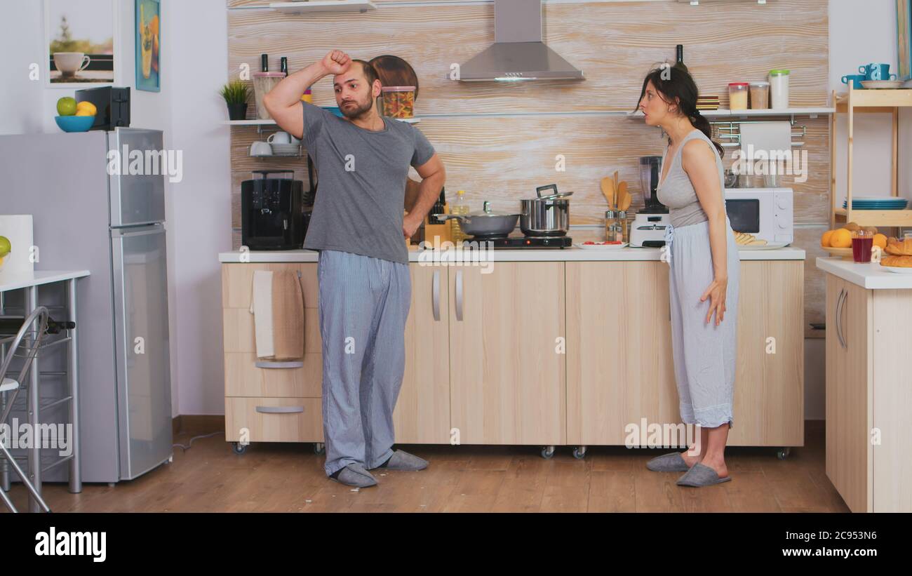 Wife breaking plate during disagreement with husband. Frustrated upset ...