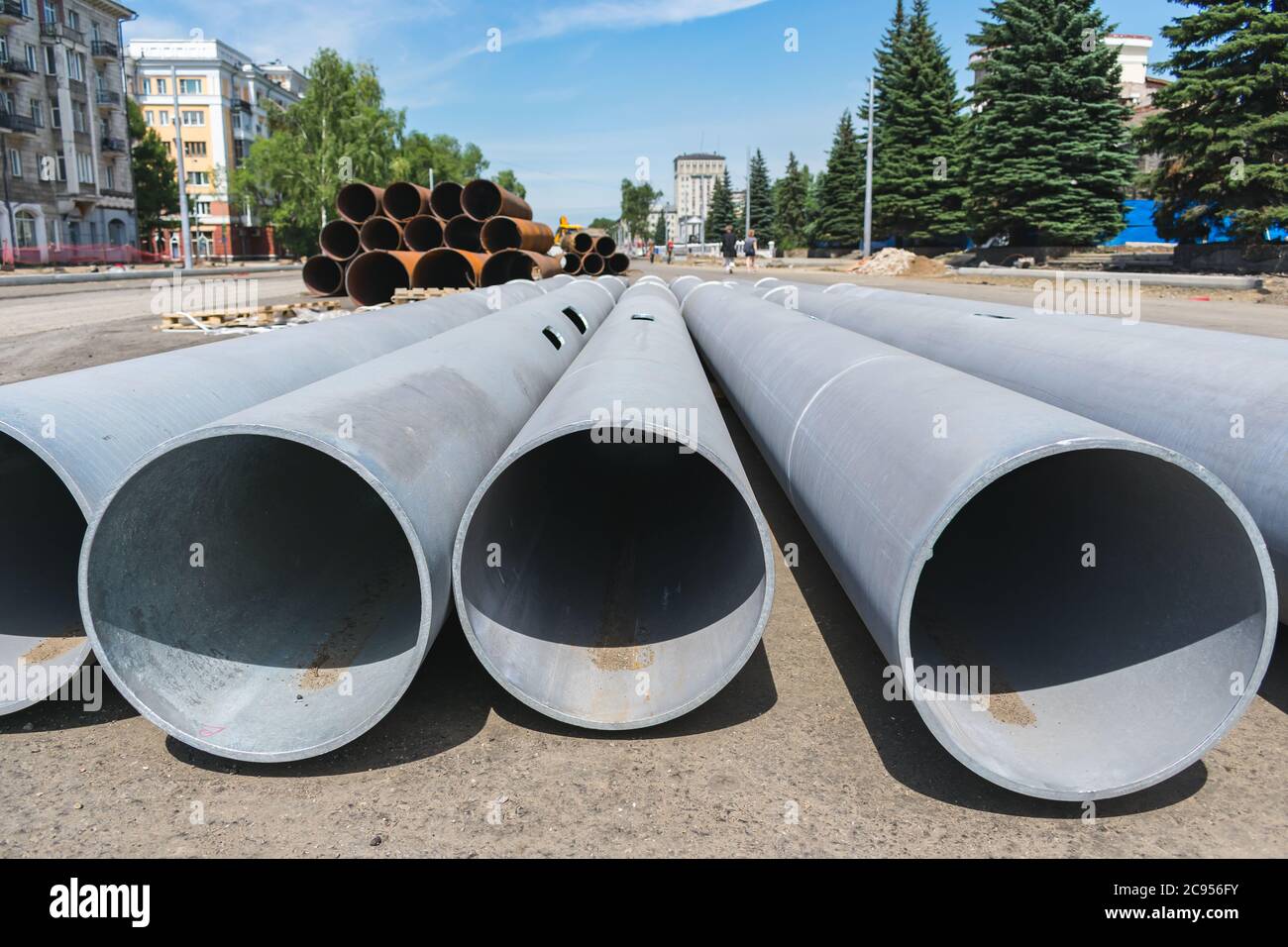 Installing new sewer pipes in place of old ones during road works Stock ...