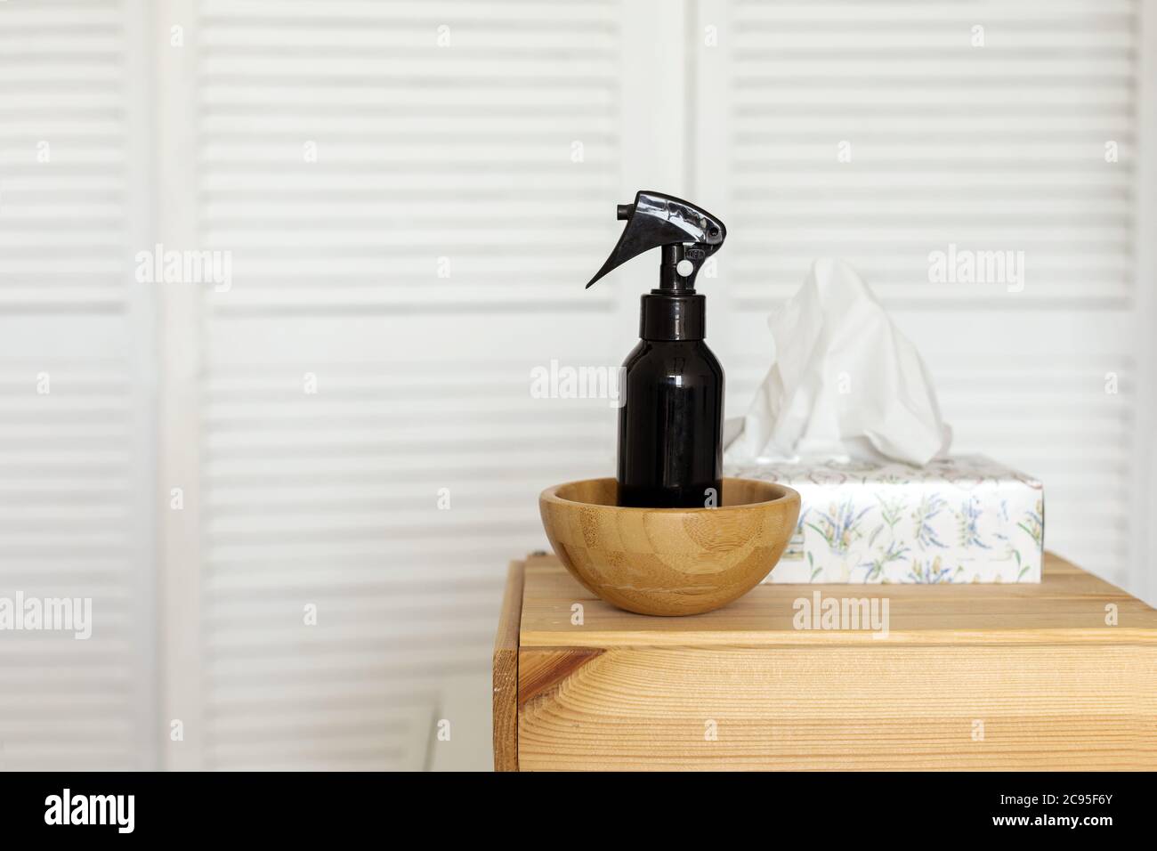 Sprayer and tissues on shelf Stock Photo - Alamy