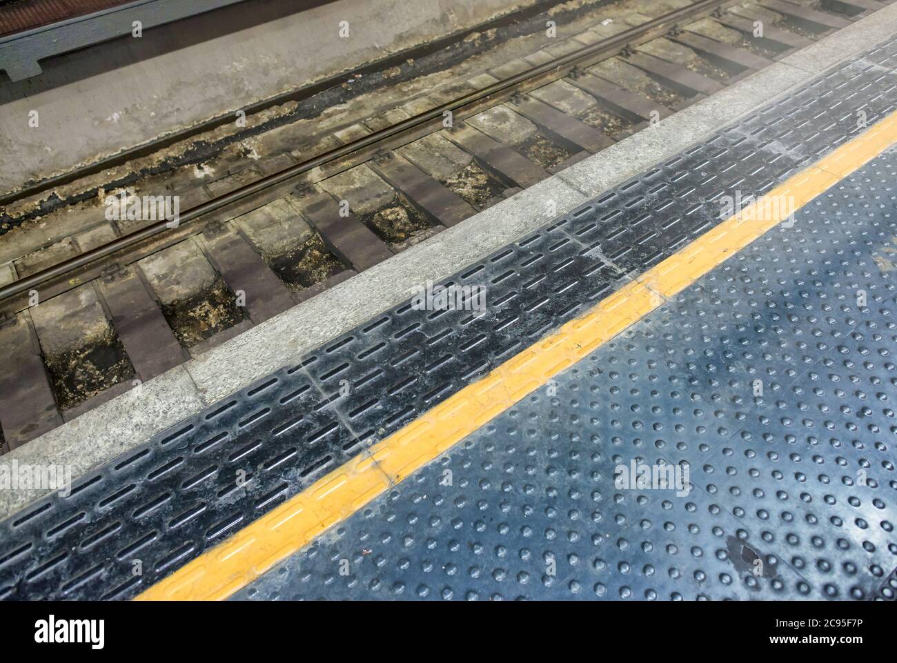 Subway station with yellow line, metro interior Stock Photo - Alamy