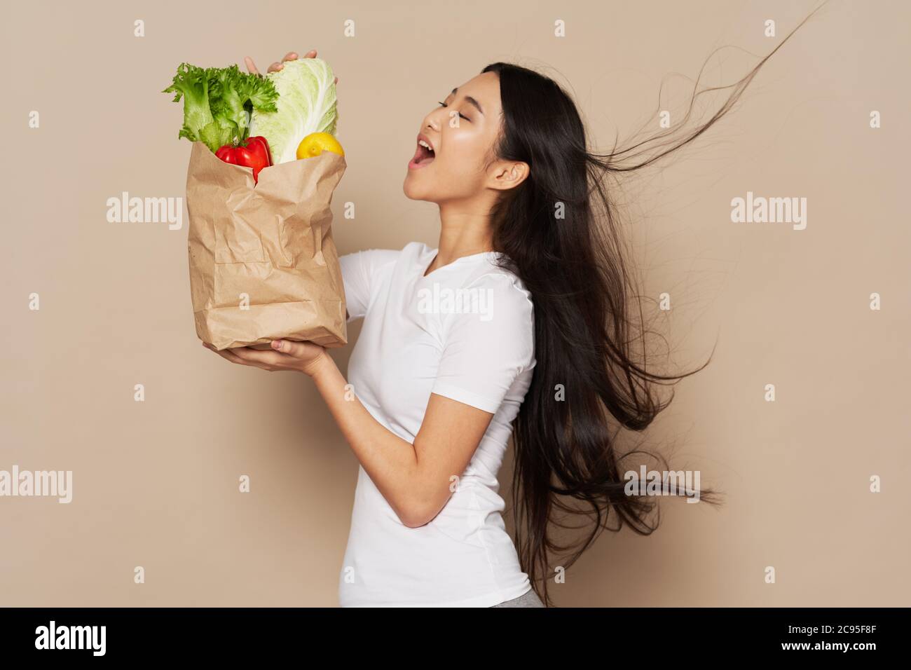 Package with products in woman hands healthy food vegetables Stock ...