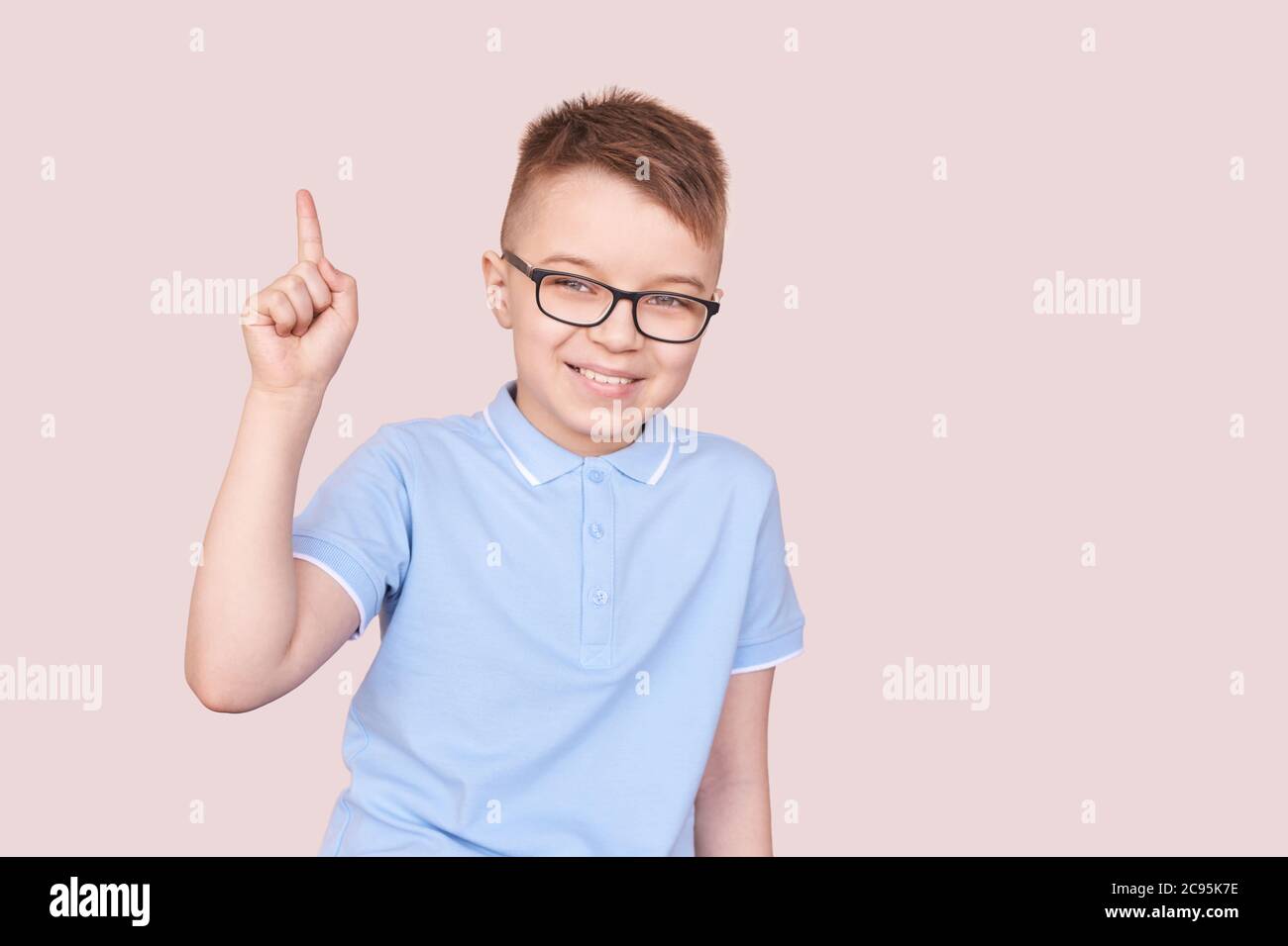 Pretty young student pointing. Elementary school children Stock Photo ...