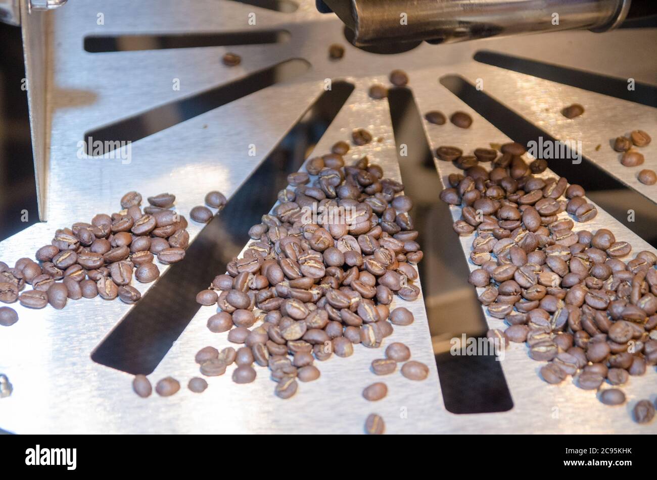 Roasting coffee beans to perfection Stock Photo - Alamy