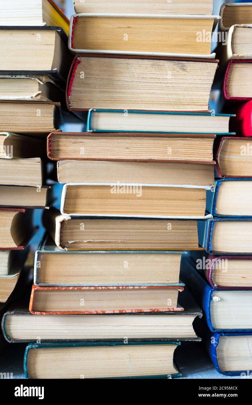 Stack of books background. a lot of books. A stack of books of ...