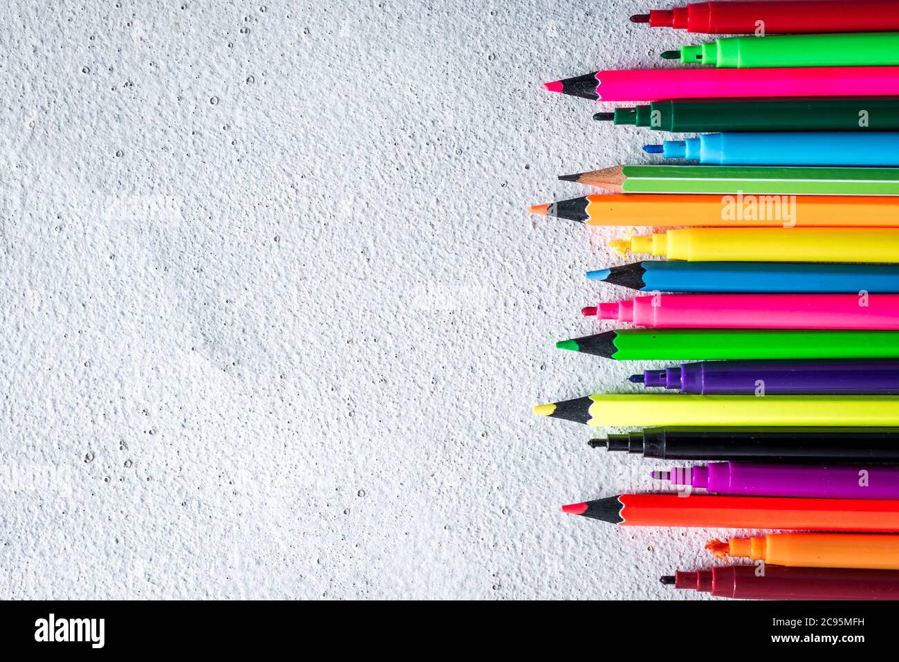 Colored pencils on a light background. Close-up. Copy space background ...