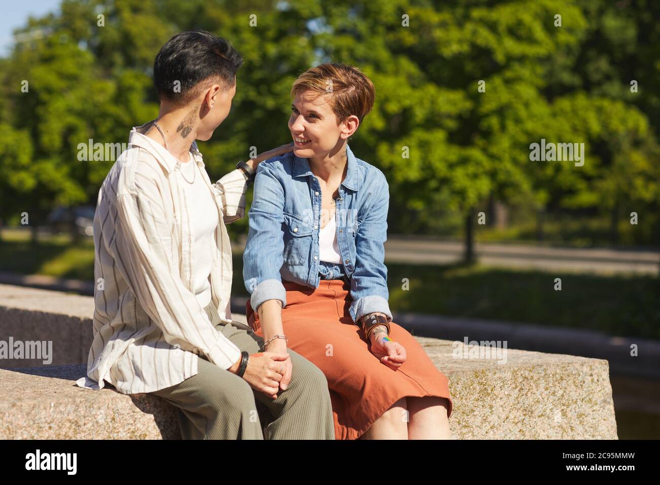 Two women flirting with each other hi-res stock photography and images ...