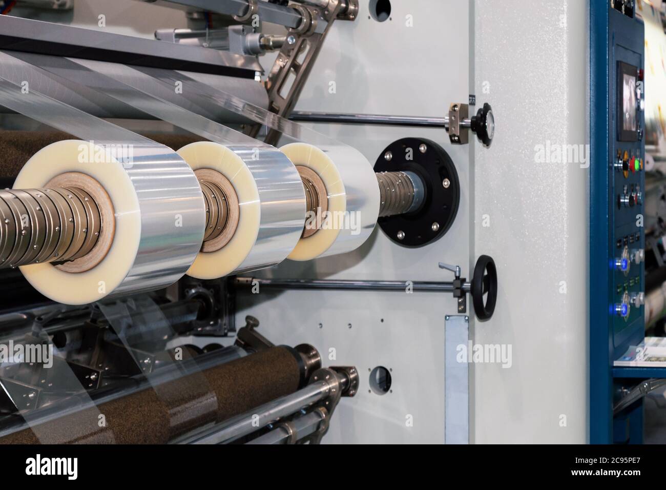 roll of plastic packaging film on the automatic packing machine in food ...