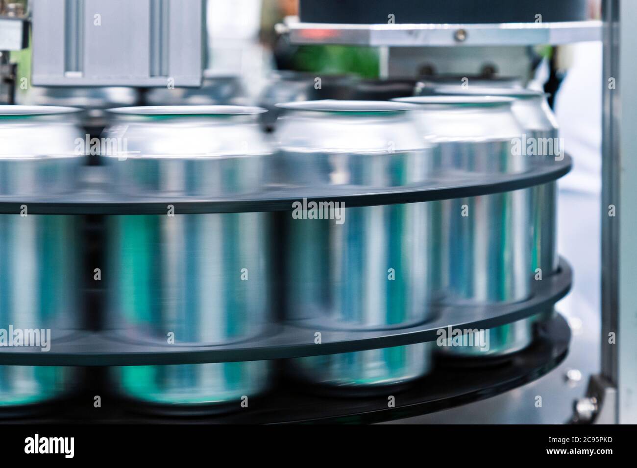 empty new aluminum cans for drink process are moving in factory line on ...