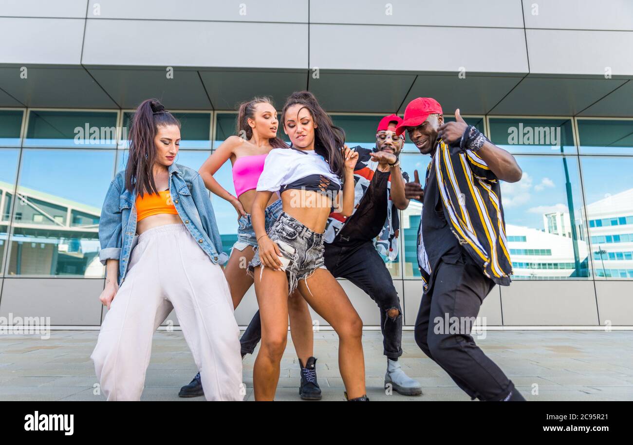 Hip hop crew dancing - Multiracial group of people having fun outdoors ...