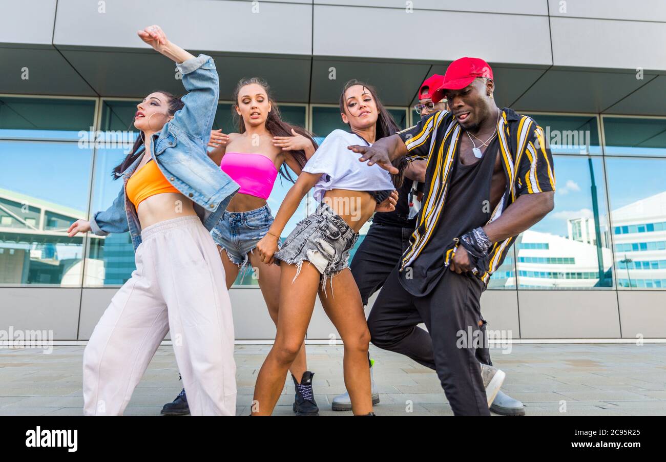 Hip hop crew dancing - Multiracial group of people having fun outdoors ...