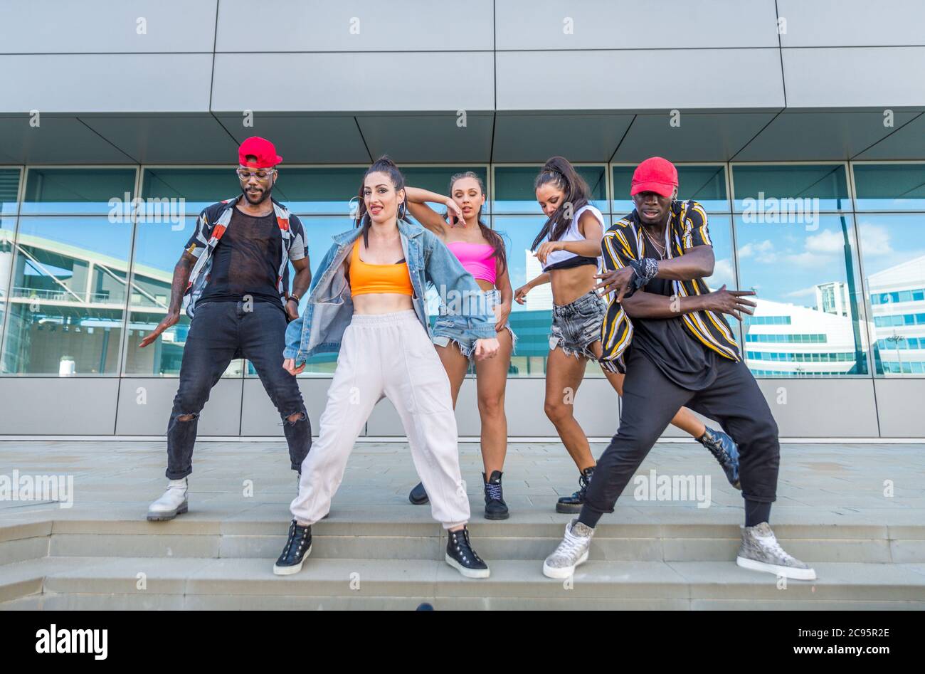 Hip hop crew dancing - Multiracial group of people having fun outdoors ...