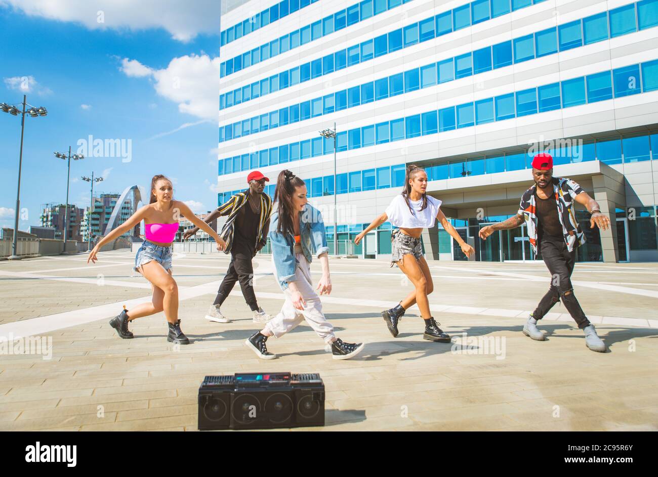 Hip hop crew dancing - Multiracial group of people having fun outdoors ...