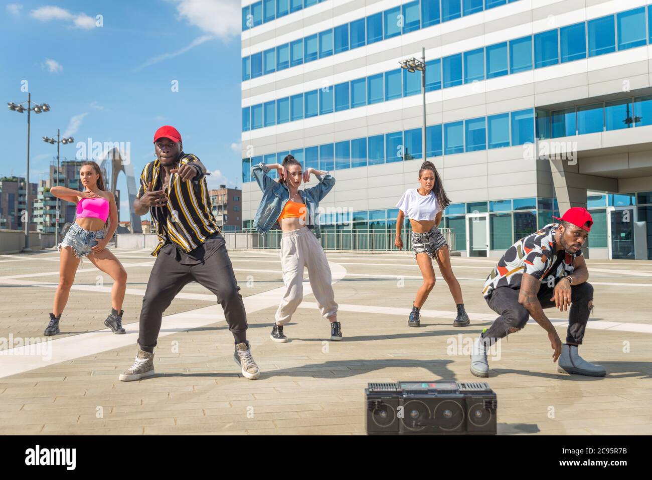 Hip hop crew dancing - Multiracial group of people having fun outdoors ...