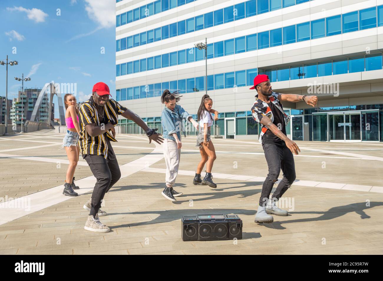 Hip hop crew dancing - Multiracial group of people having fun outdoors ...